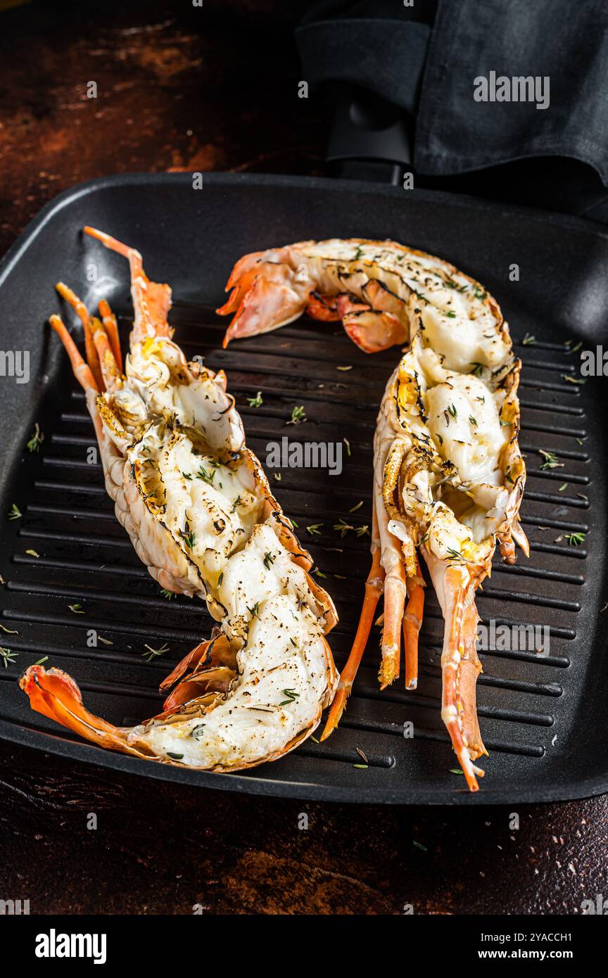Delicious grilled and sliced Spiny lobster or sea crayfish. Dark ...