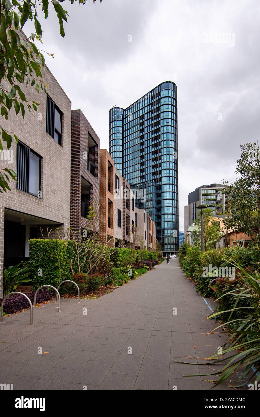 A garden lined walking and cycle path joins mixed height properties in ...
