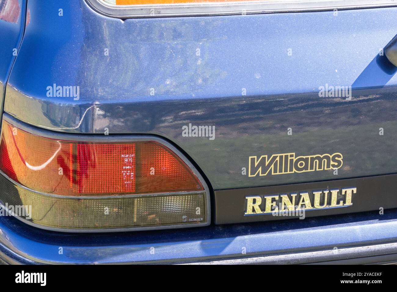 The renault williams badge is displayed on the back of a blue car ...
