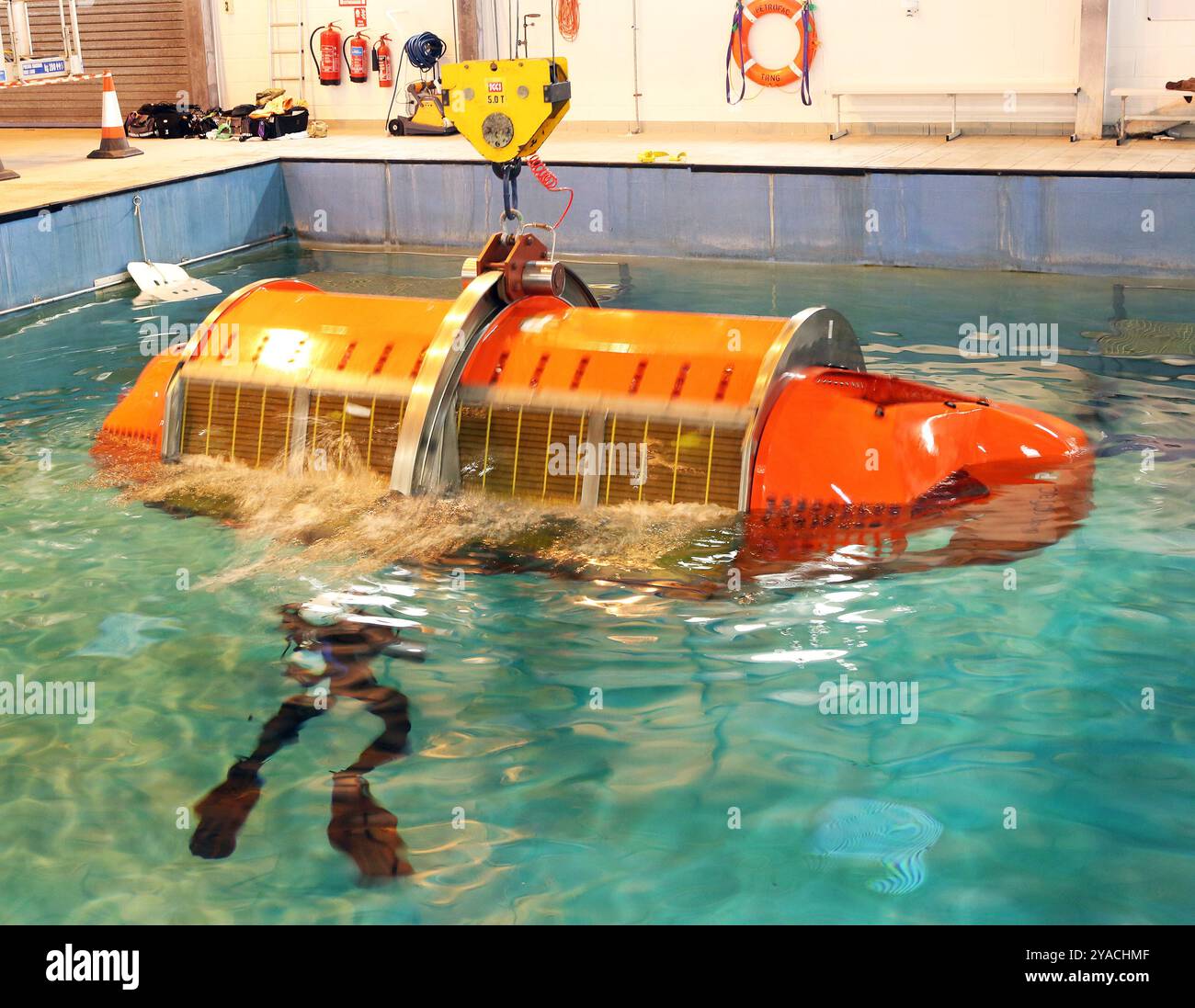 Trainees undertaking the helicopter underwater escape training for the ...