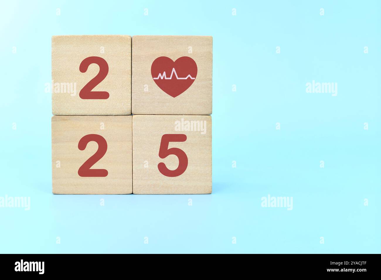 Year 2025 health priority concept. Wooden blocks on blue background ...