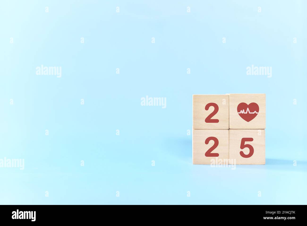 Year 2025 health priority concept. Wooden blocks on blue background ...