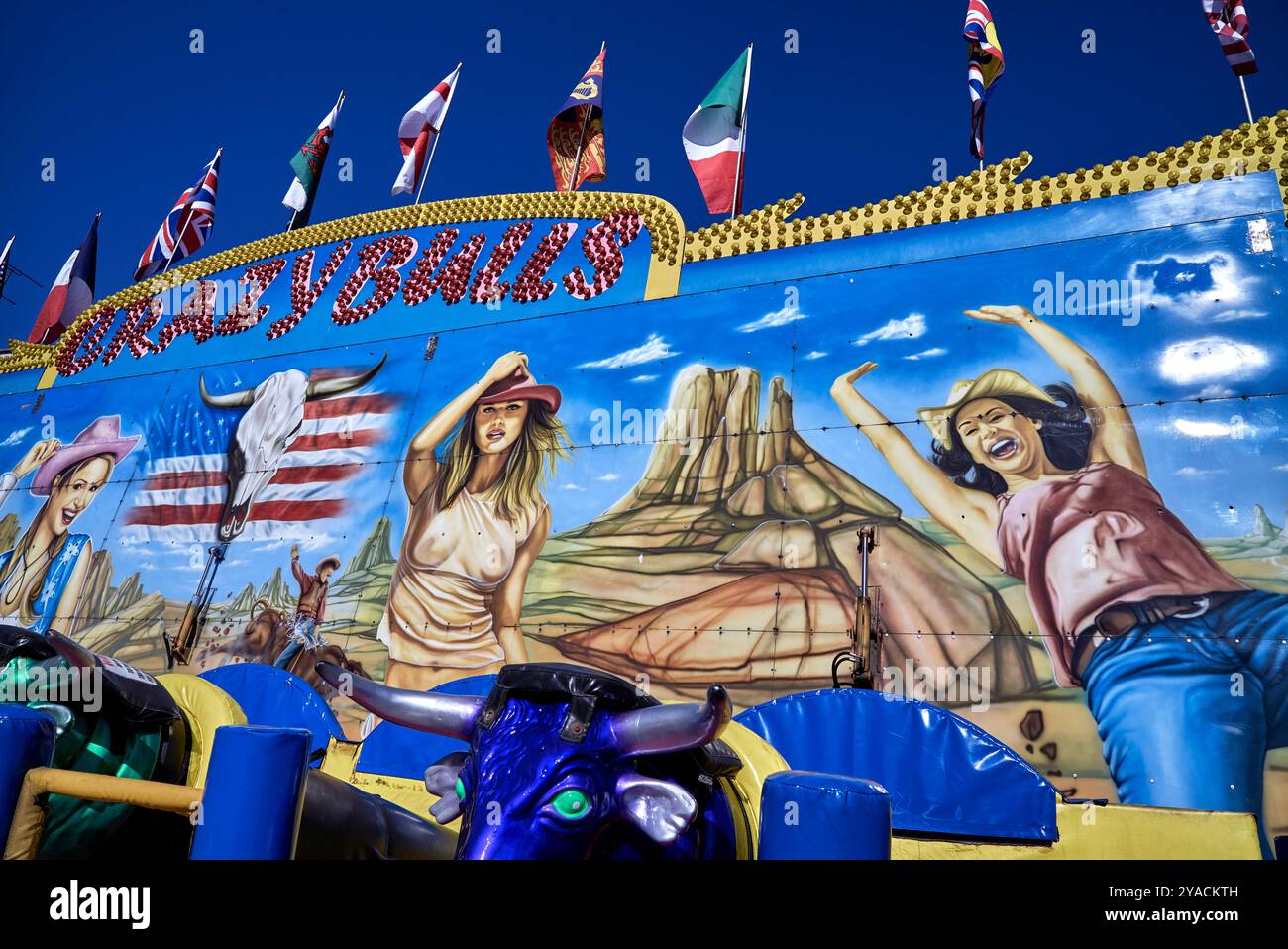 Fairground art of American Crazy Bulls thrill ride Stock Photo - Alamy
