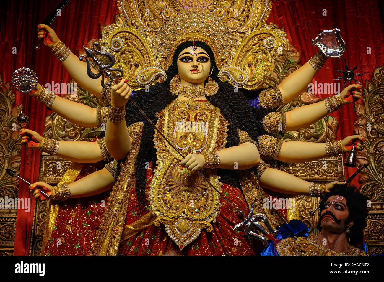 Idol of Goddess Devi Durga at a decorated puja pandal in Kolkata, West Bengal, India. Durga Puja ...