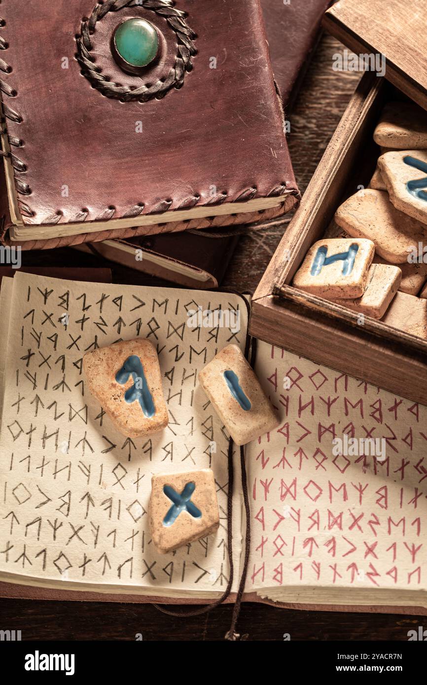 Closeup of runestones and ancient scrolls with futhark language as ...