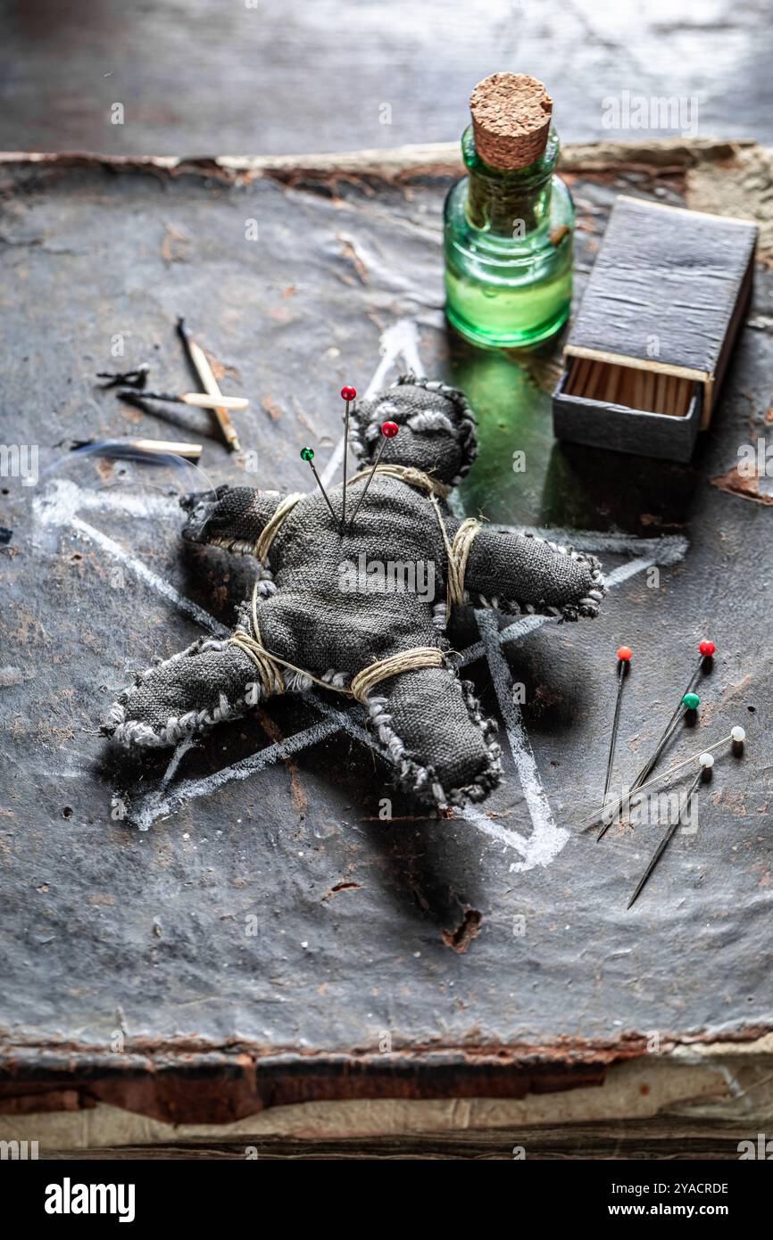 Scary voodoo doll burned with a needle and fire as a Halloween ...