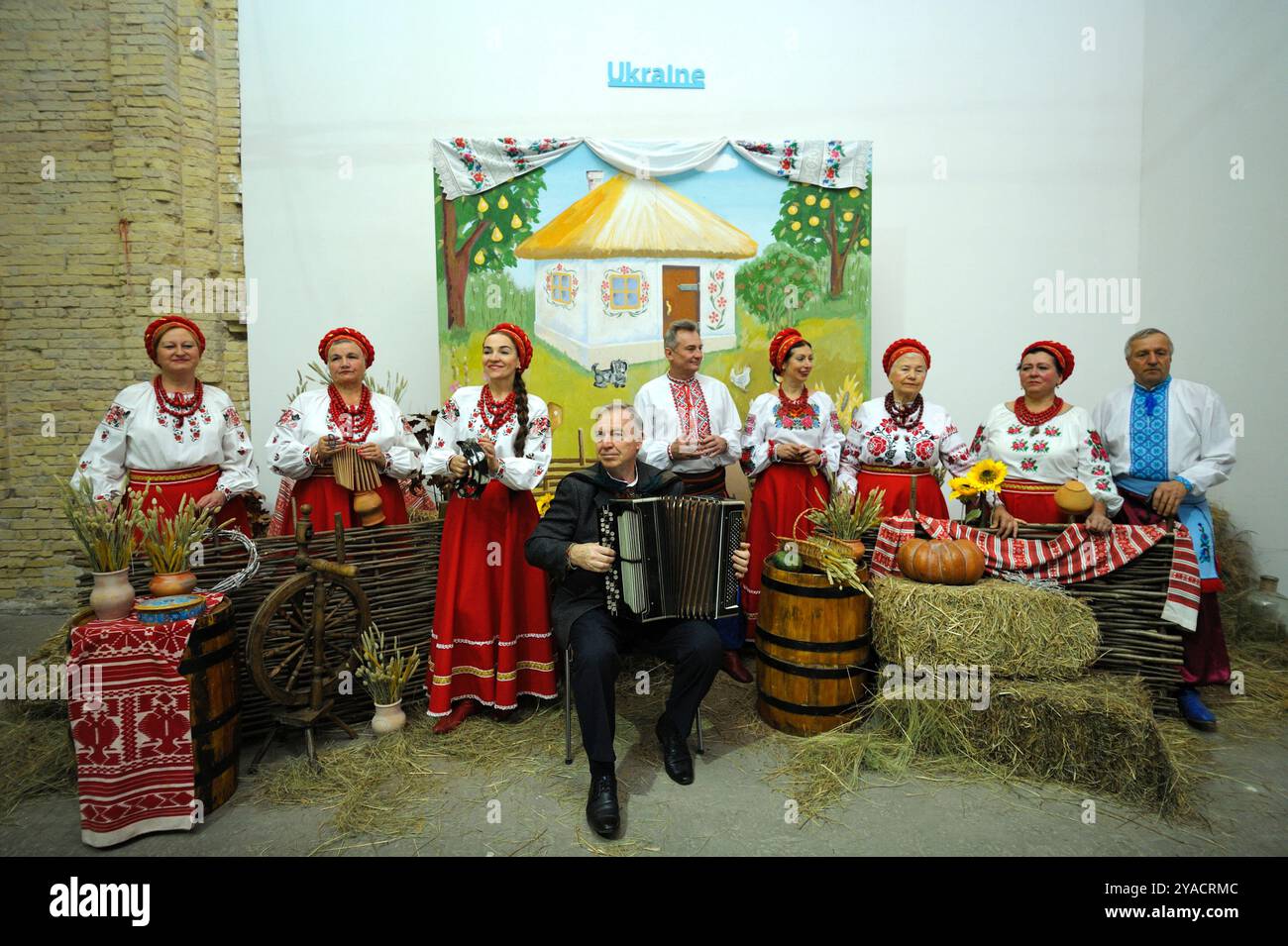 People in traditional Ukrainian clothes playing folk instruments at a ...