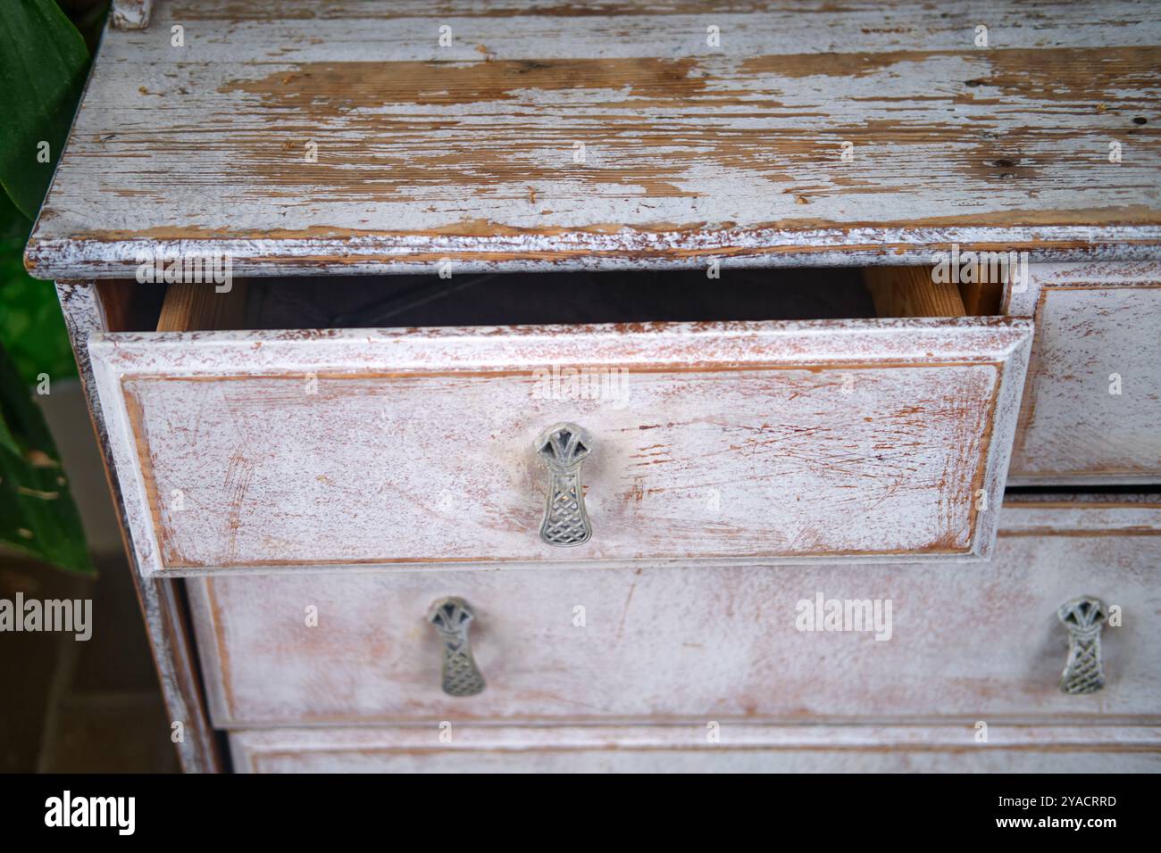 An open drawer of an old white shabby chest of drawers Stock Photo - Alamy