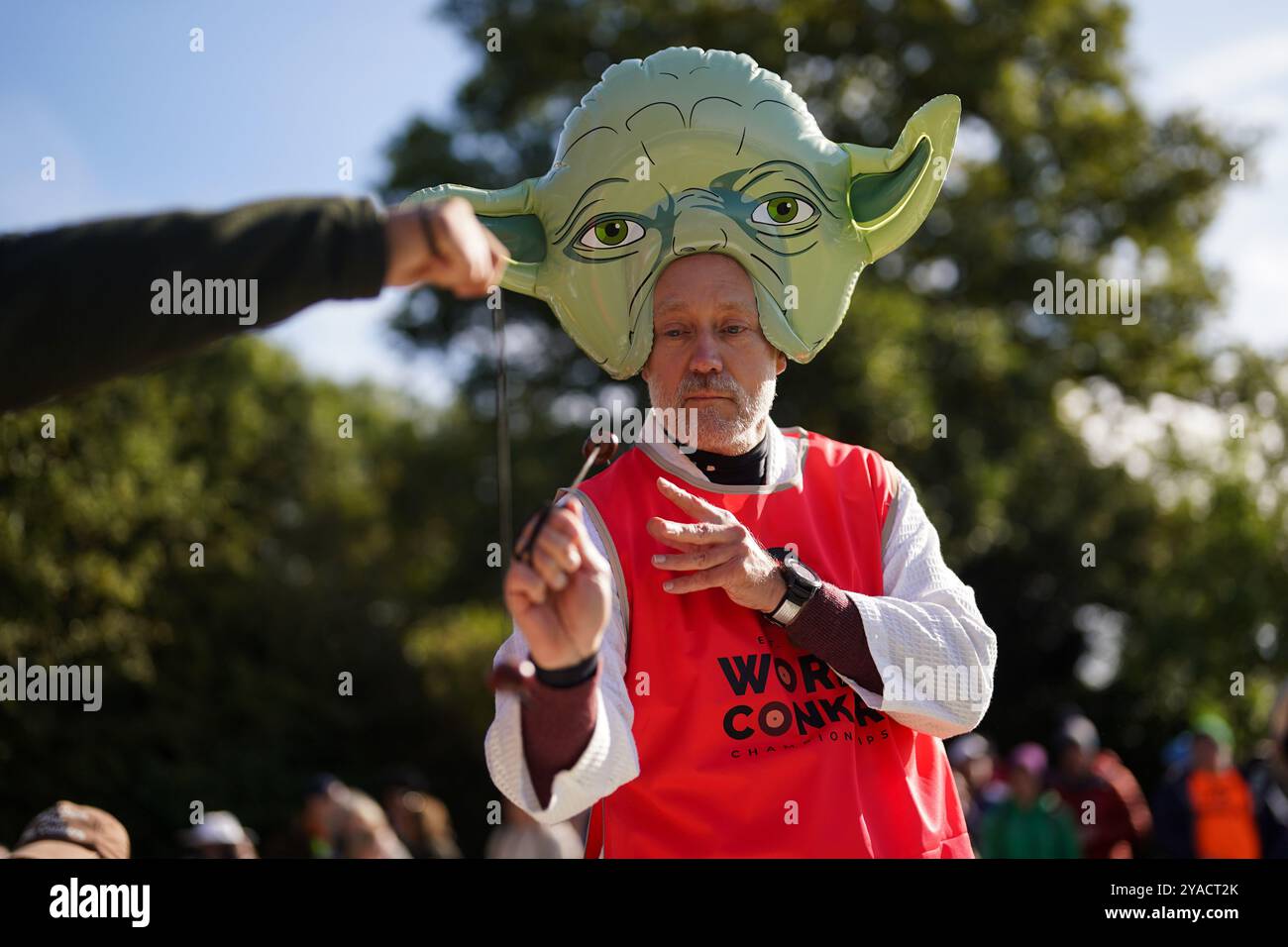 A competitor wearing Star Wars themed Yoda costume take part in the ...