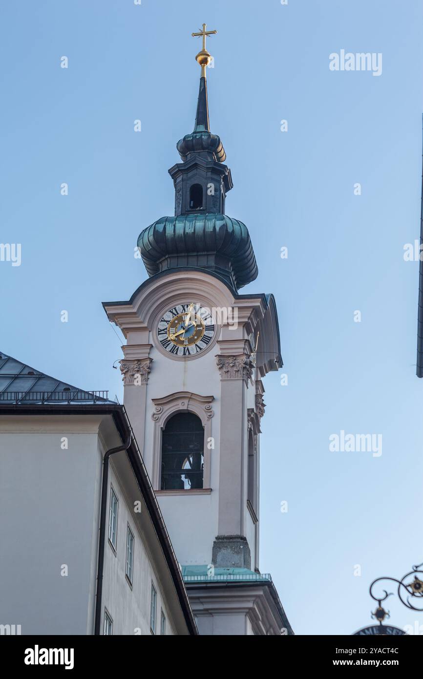 Iconic Sebastianskirche church clock tower in Linzer Gasse street ...