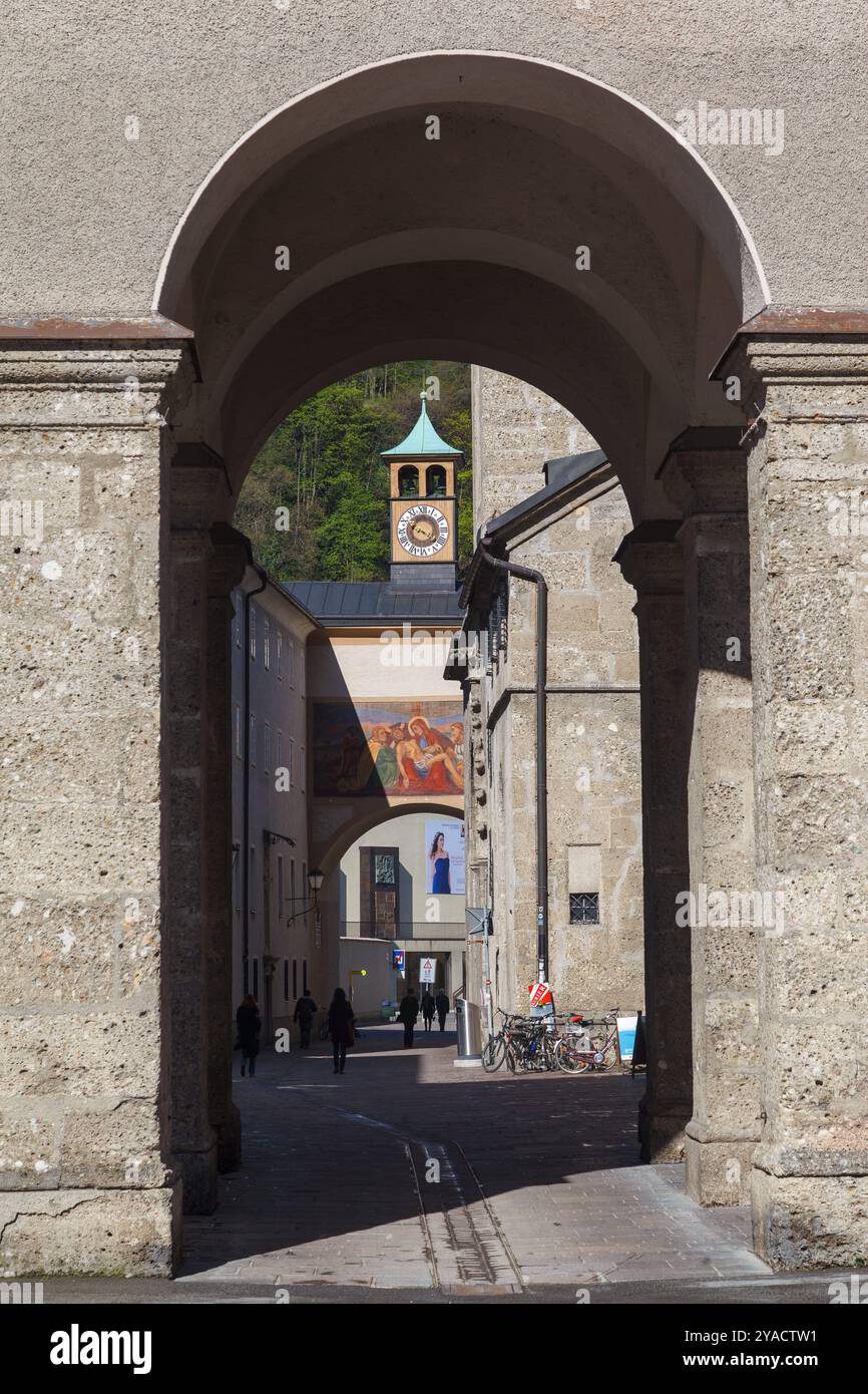 The Fresco and clock tower framed by an arch in the Franziskanergasse ...