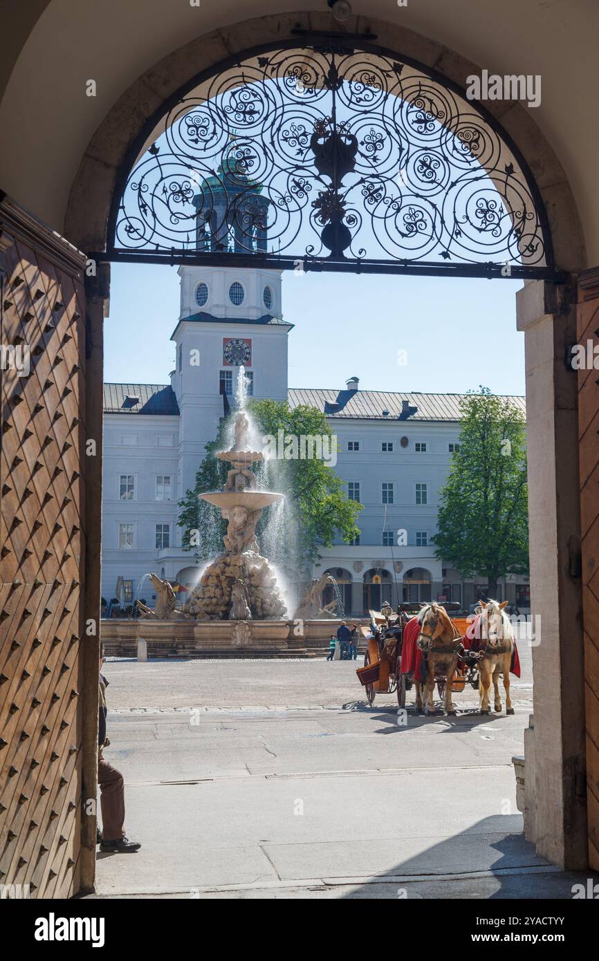 A charriot with horses at the Residenzplatz square with the ...
