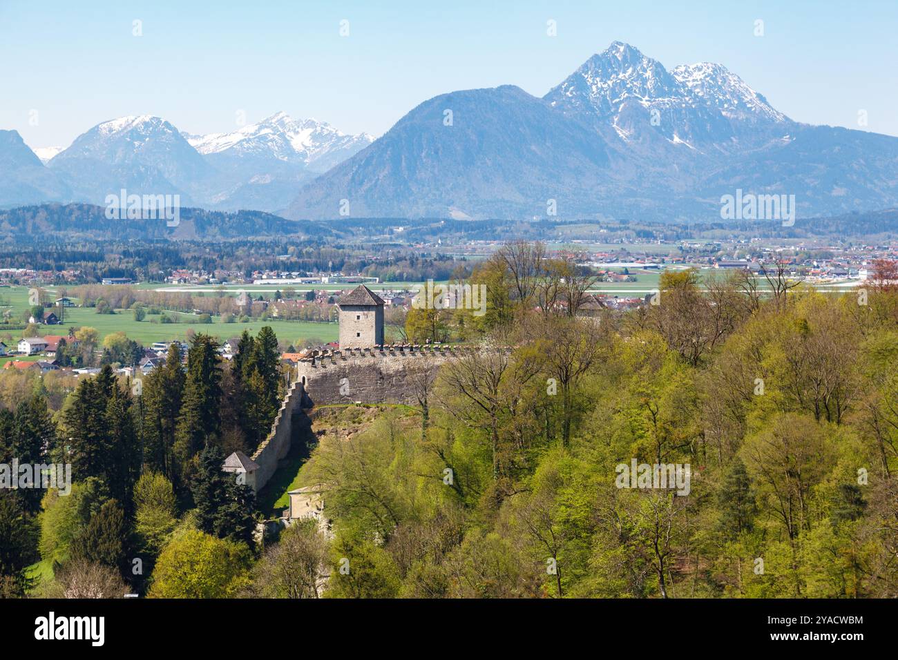 The walls of the Hohensalzburg fortress keep and the Alps snowcapped ...