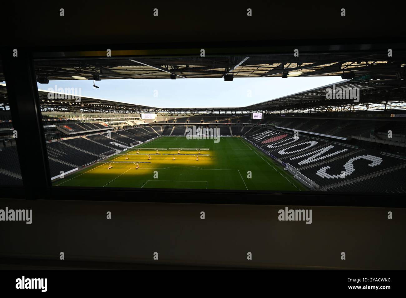 Looking through a hotel corridor at the MK Dons football stadium Stock ...