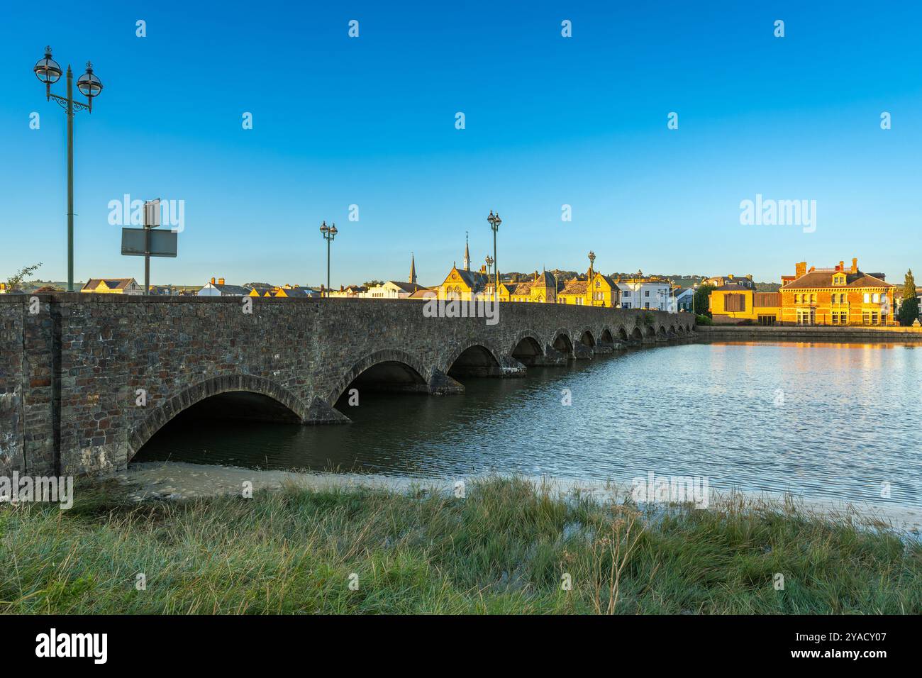 Barnstaple by sunset, view of the historical long bridge and river Taw ...
