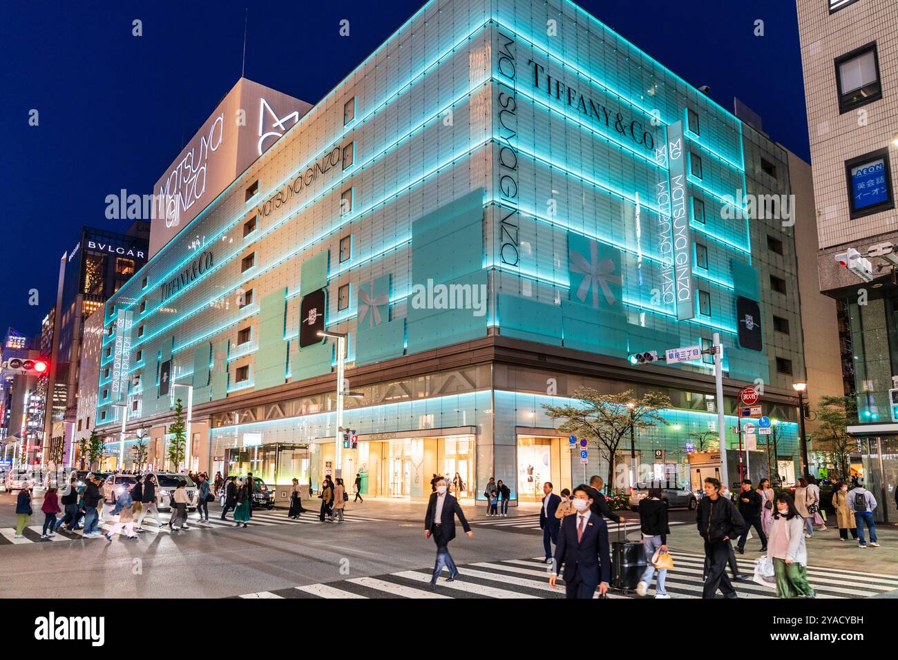 Ginza with the landmark Matsuya Ginza and Tiffany store building illuminated in blue green ...
