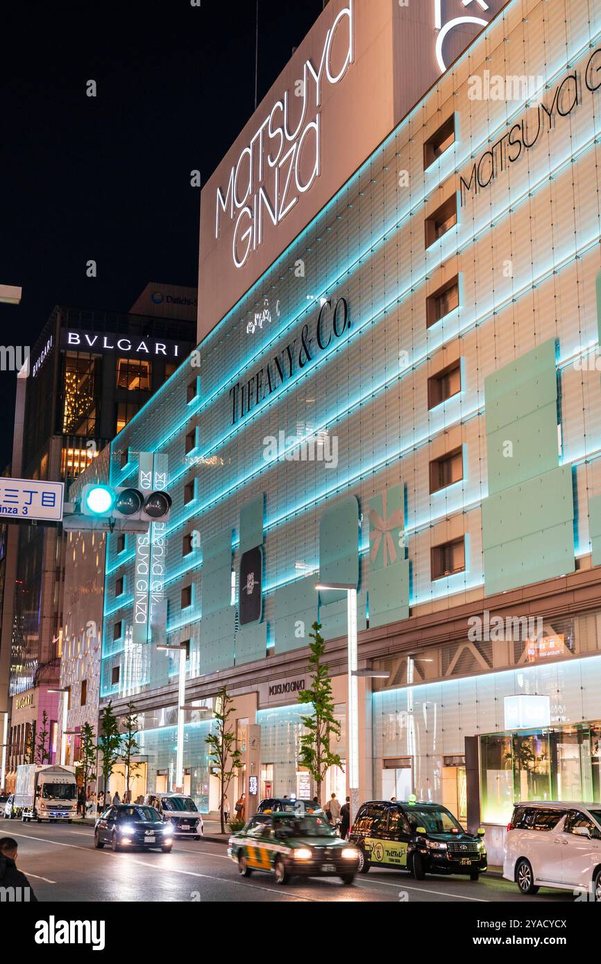 The landmark Matsuya Ginza and Tiffany store building illuminated in blue green diffused light ...