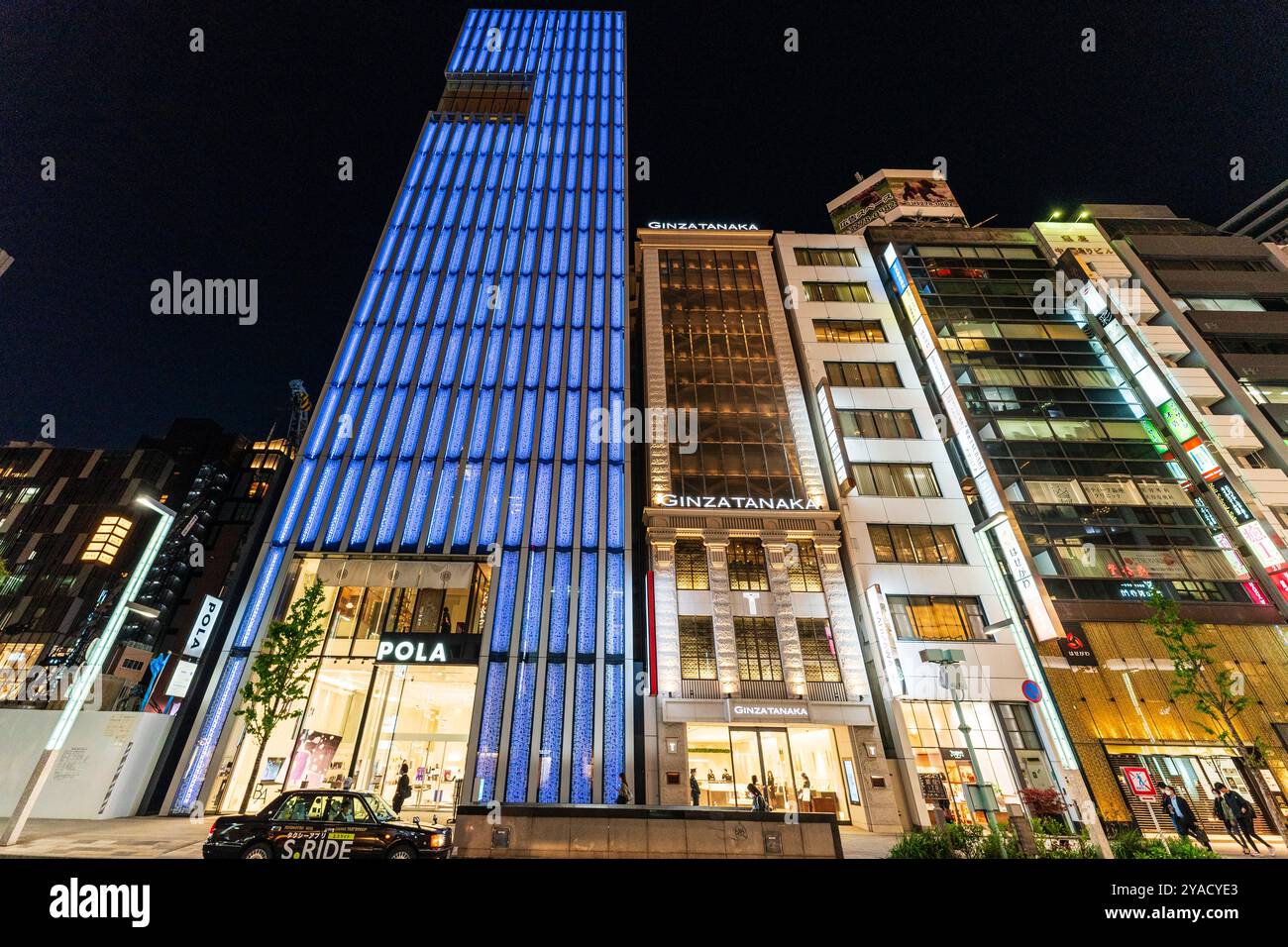 Pola flagship store at night. Large display window and entrance area ...