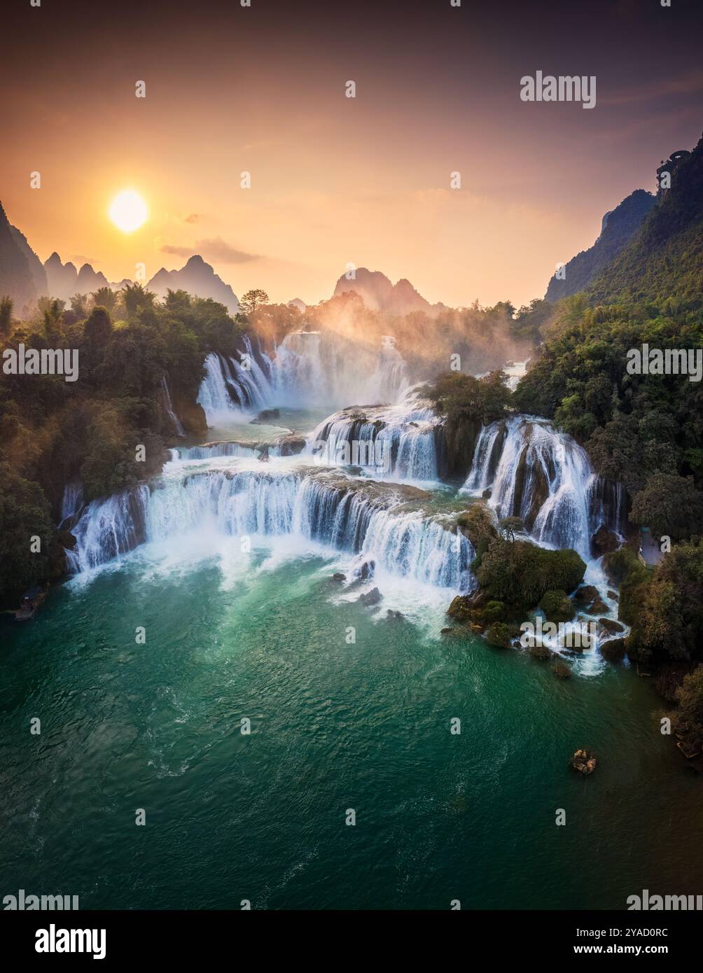 Aerial view of majestic Ban Gioc waterfall, Detian Falls flowing in ...