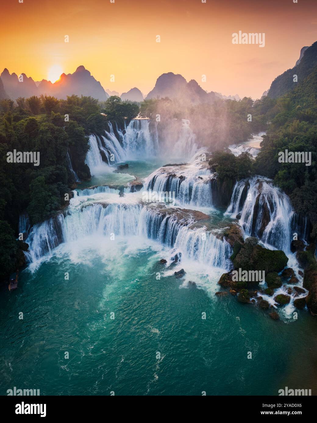 Aerial view of majestic Ban Gioc waterfall, Detian Falls flowing in ...