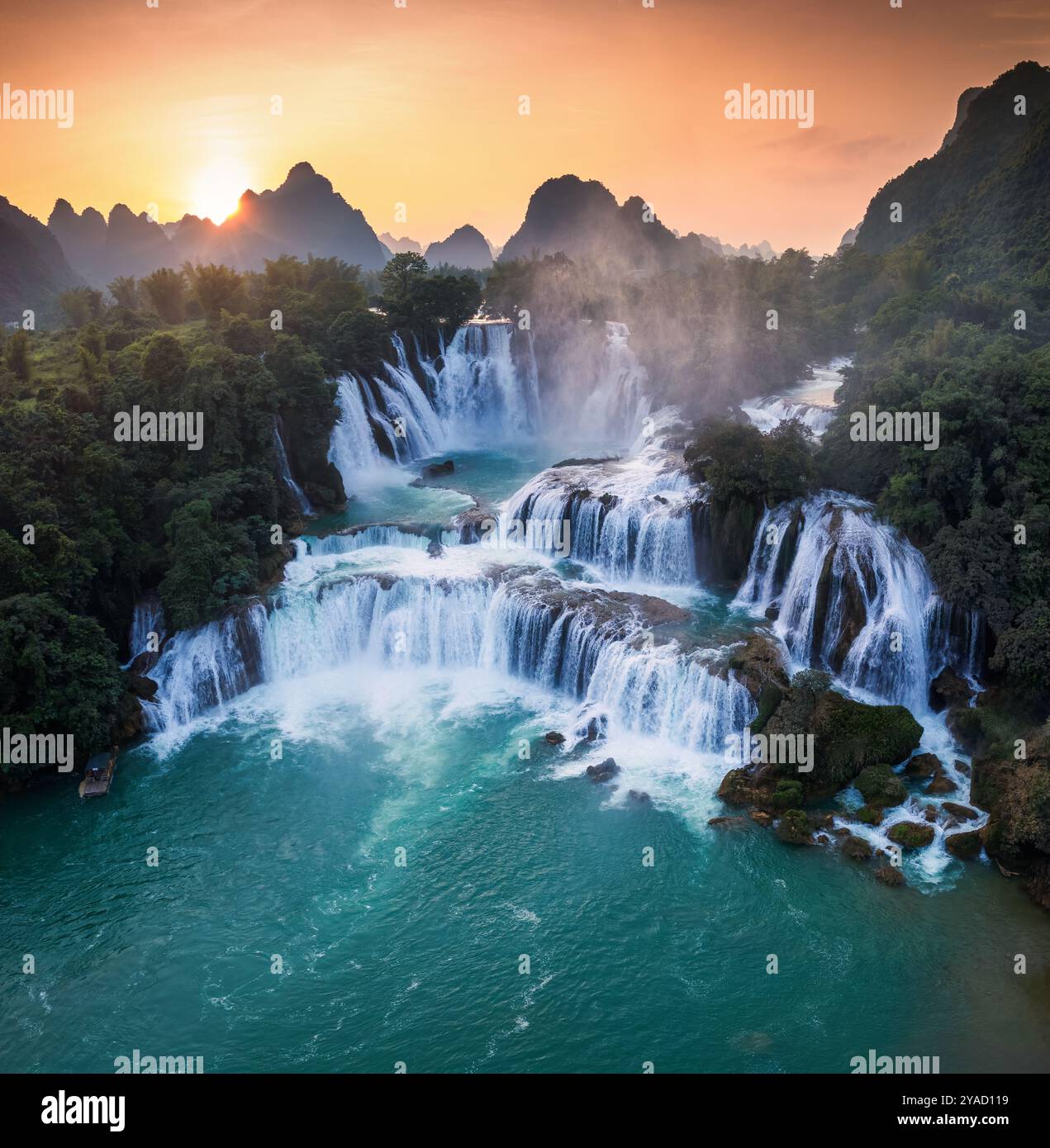 Aerial view of majestic Ban Gioc waterfall, Detian Falls flowing in ...