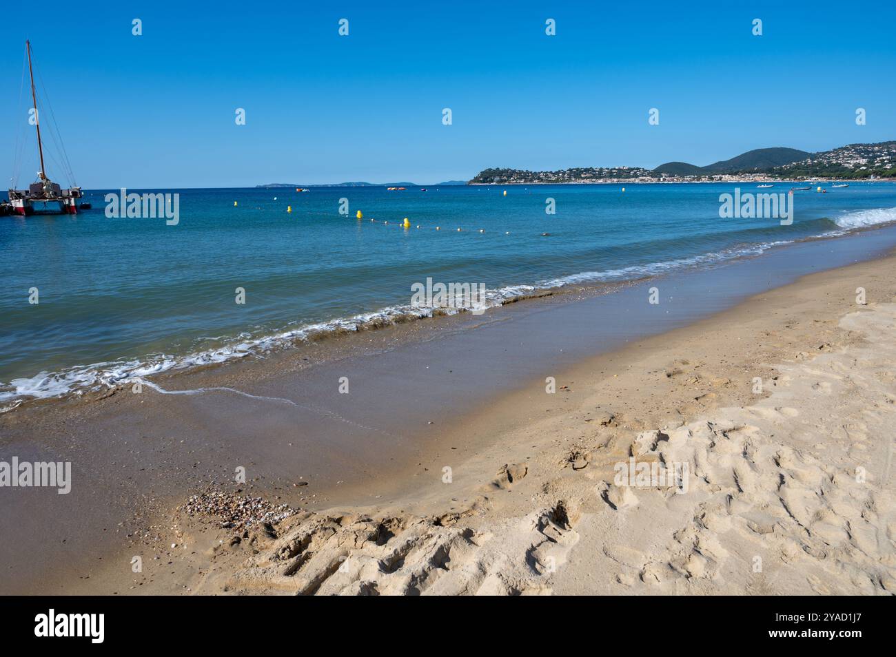Morning view on crystal clear blue water and pier of Plage du ...