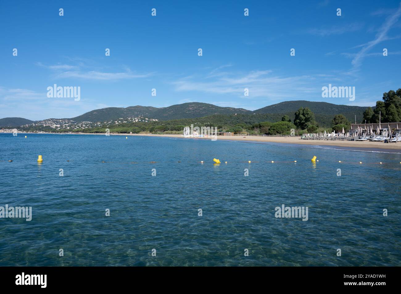 Morning view on crystal clear blue water and pier of Plage du ...