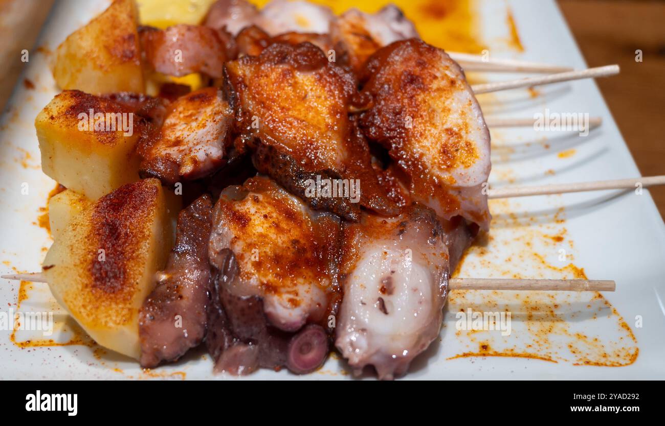 Typical snack of Basque Country, pinchos or pinxtos skewers with small ...