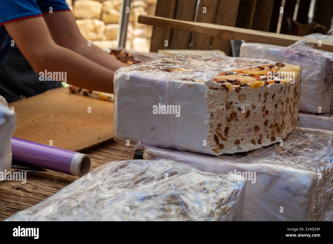 Fresh dessert traditional white nougat with chocolate, nuts and fruits ...