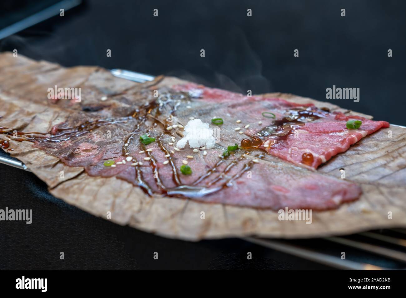 Wagyu Hoba Yaki, sliced beef on Hoba leaf on the grill Stock Photo - Alamy