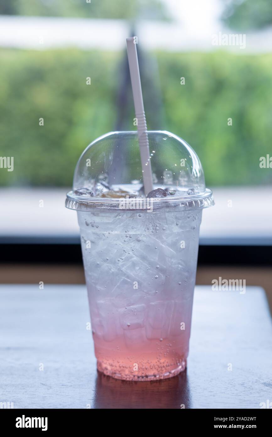 A cup of lychee lemon soda on the table, with bokeh background of the ...