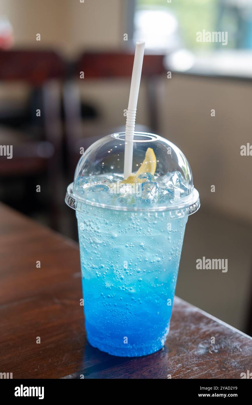 Blue lemonade soda served in a cup with lemon Stock Photo - Alamy