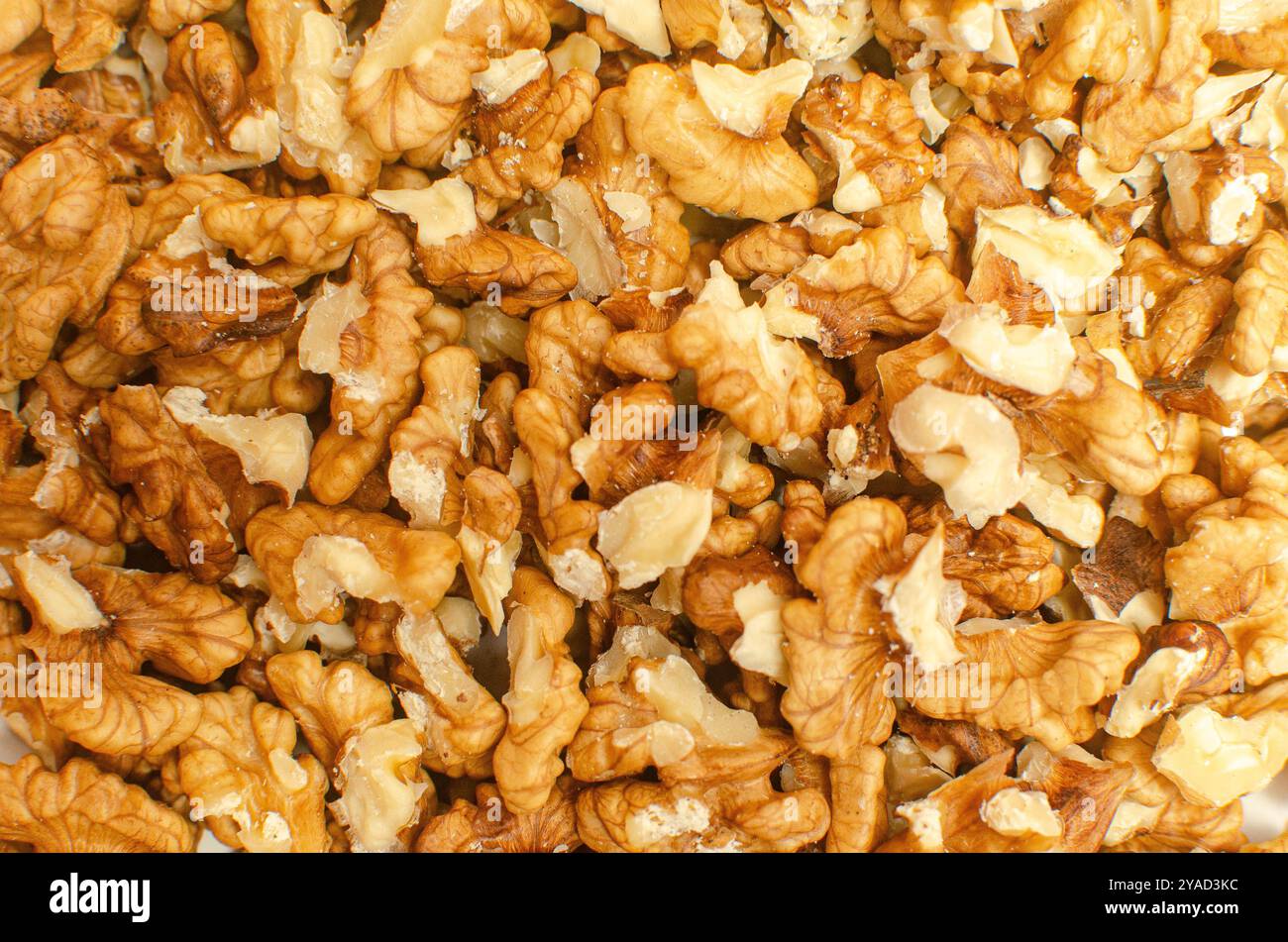 Pile of peeled walnuts ready for sale at a popular market. Background ...