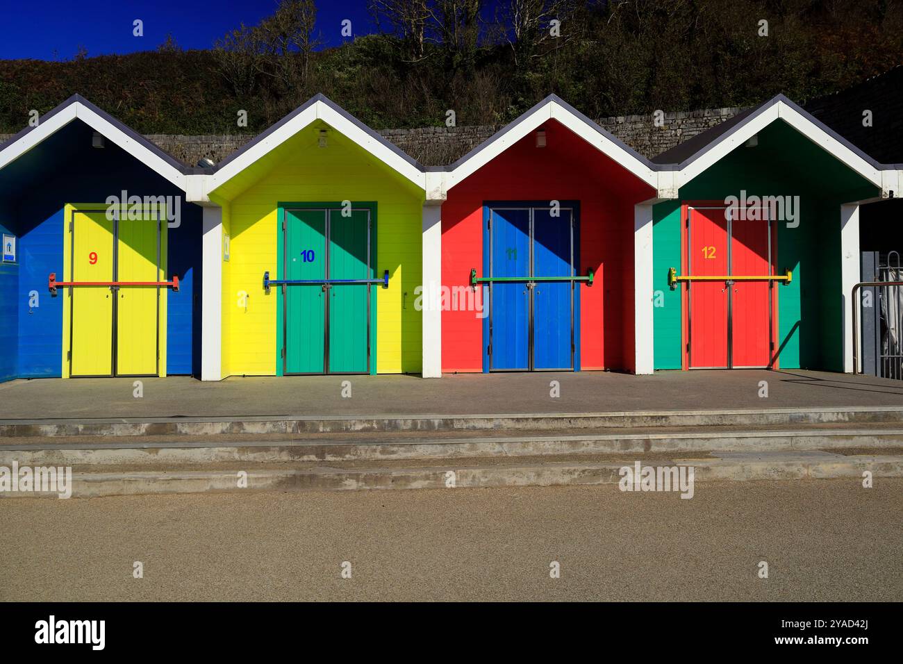 Colourful wooden beach huts at Barry Island, South Wales, UK. Taken ...