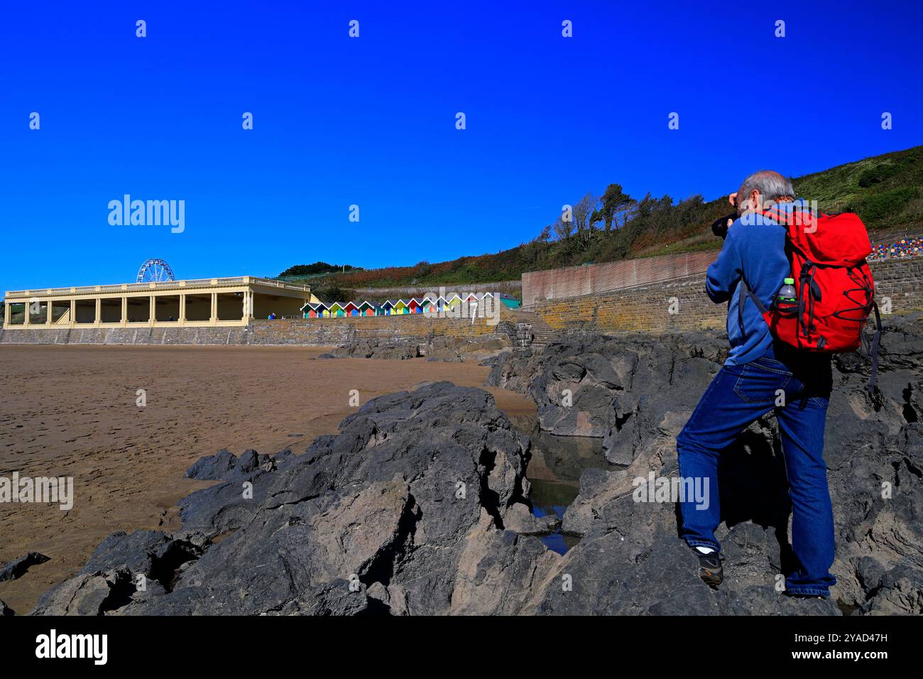 Landscape photographer at work, Barry Island, South Wales, UK. Taken ...