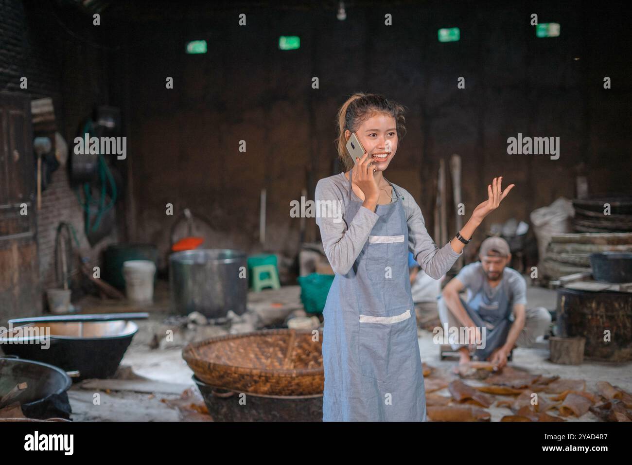 Portrait of a Young Woman Engaged in Traditional Food Processing ...