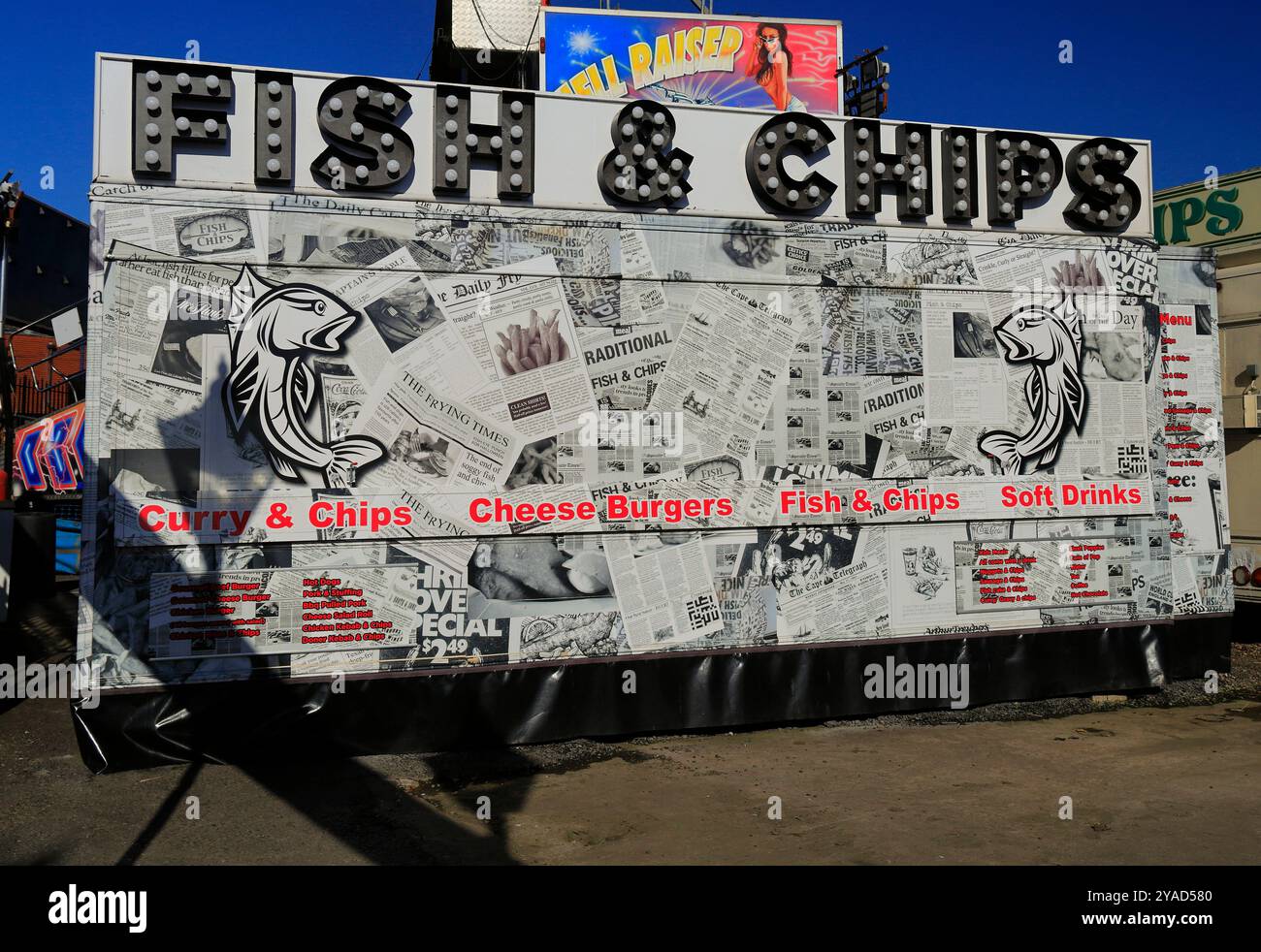 Closed up Fish and Chips van with black and white newspaper decoration ...