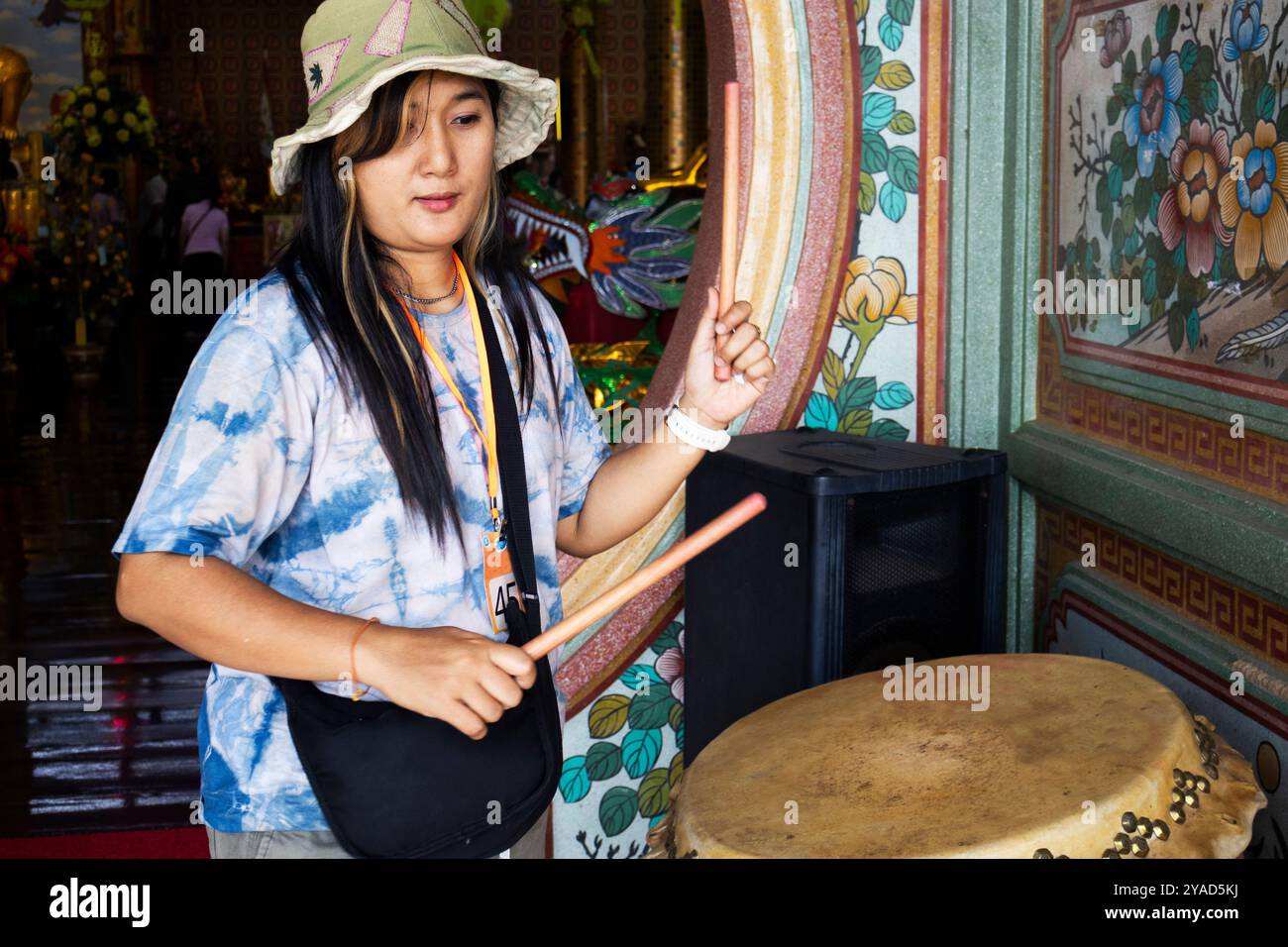 Travelers thai women people travel and hit knock large bell drum gong ...