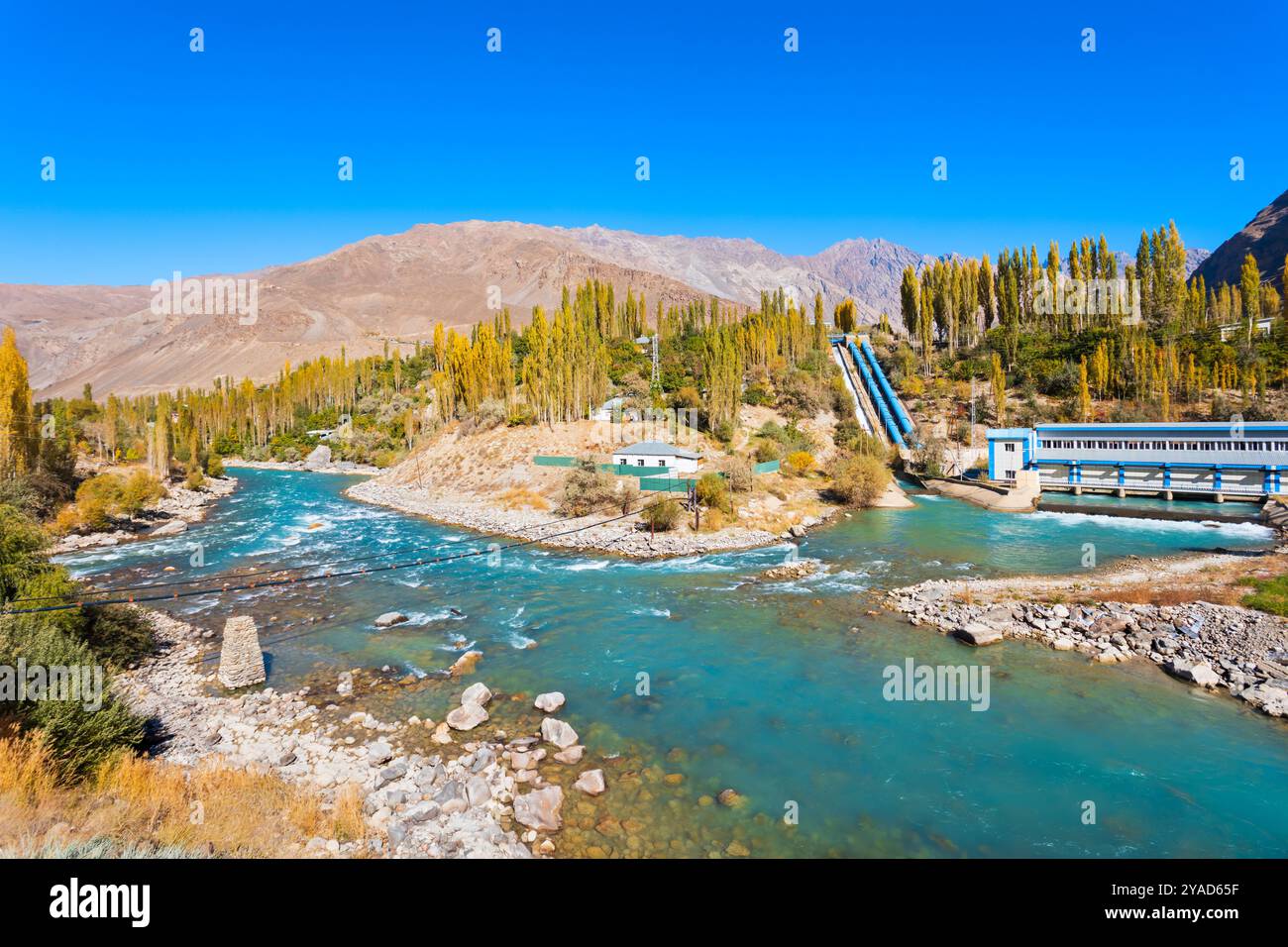Dam on the Ghunt river and Pamir mountains aerial panoramic view ...