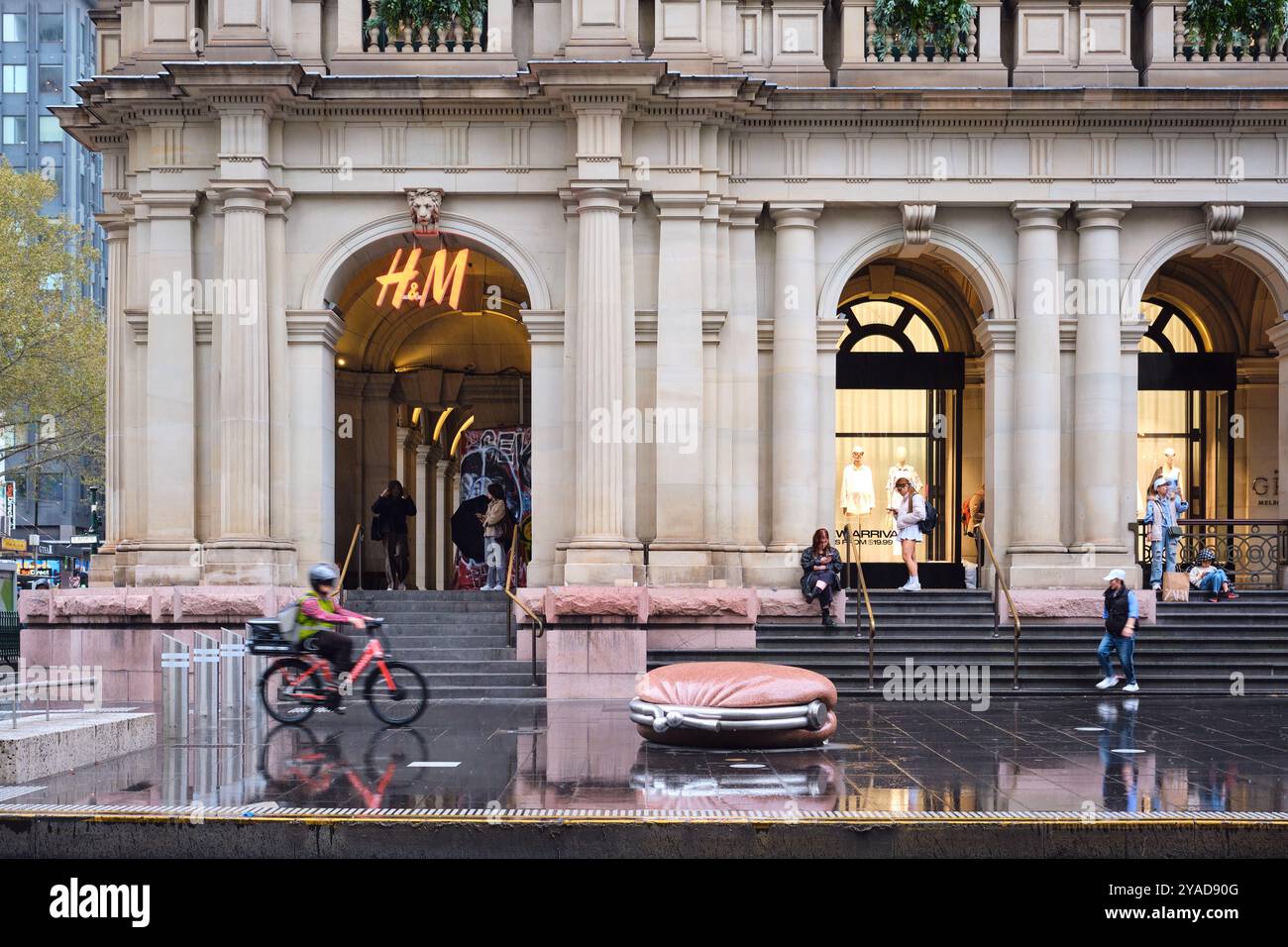 People in the Bourke Street Mall outside the H&M store in the former ...