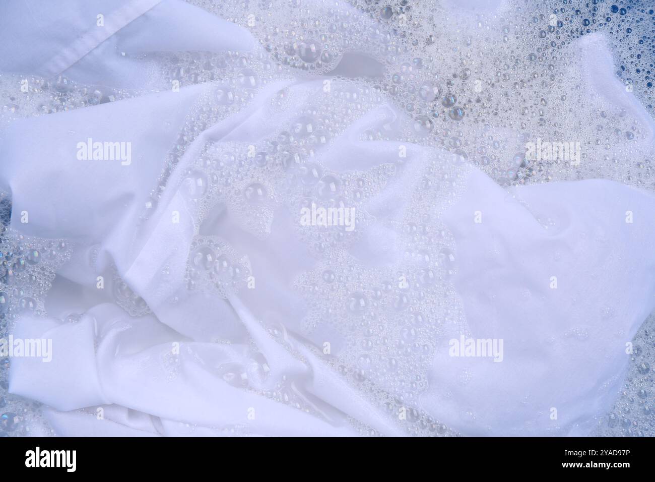 White garment in suds, closeup. Hand washing laundry Stock Photo - Alamy