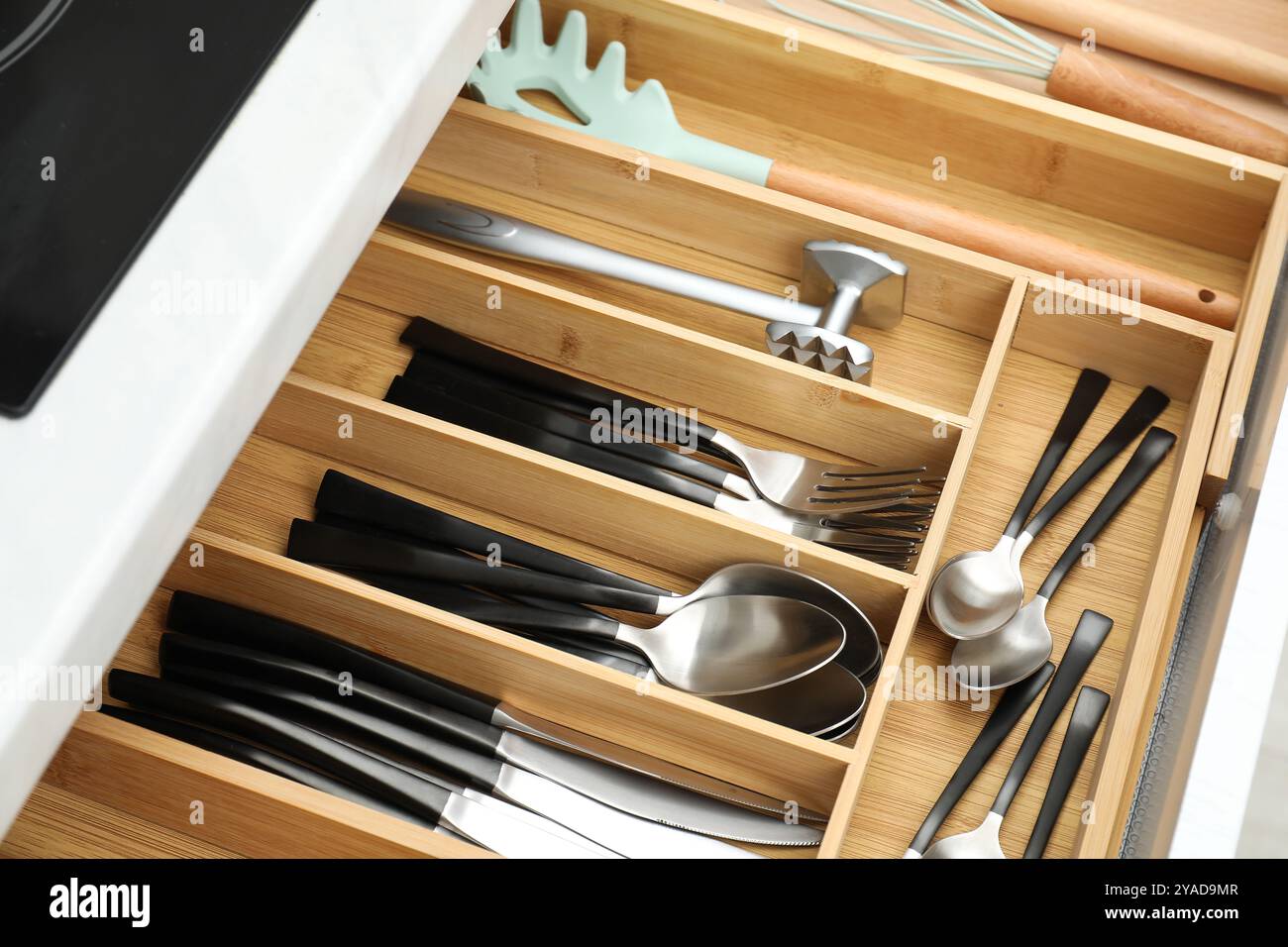Box with cutlery in drawer, closeup. Kitchen utensils storage Stock ...