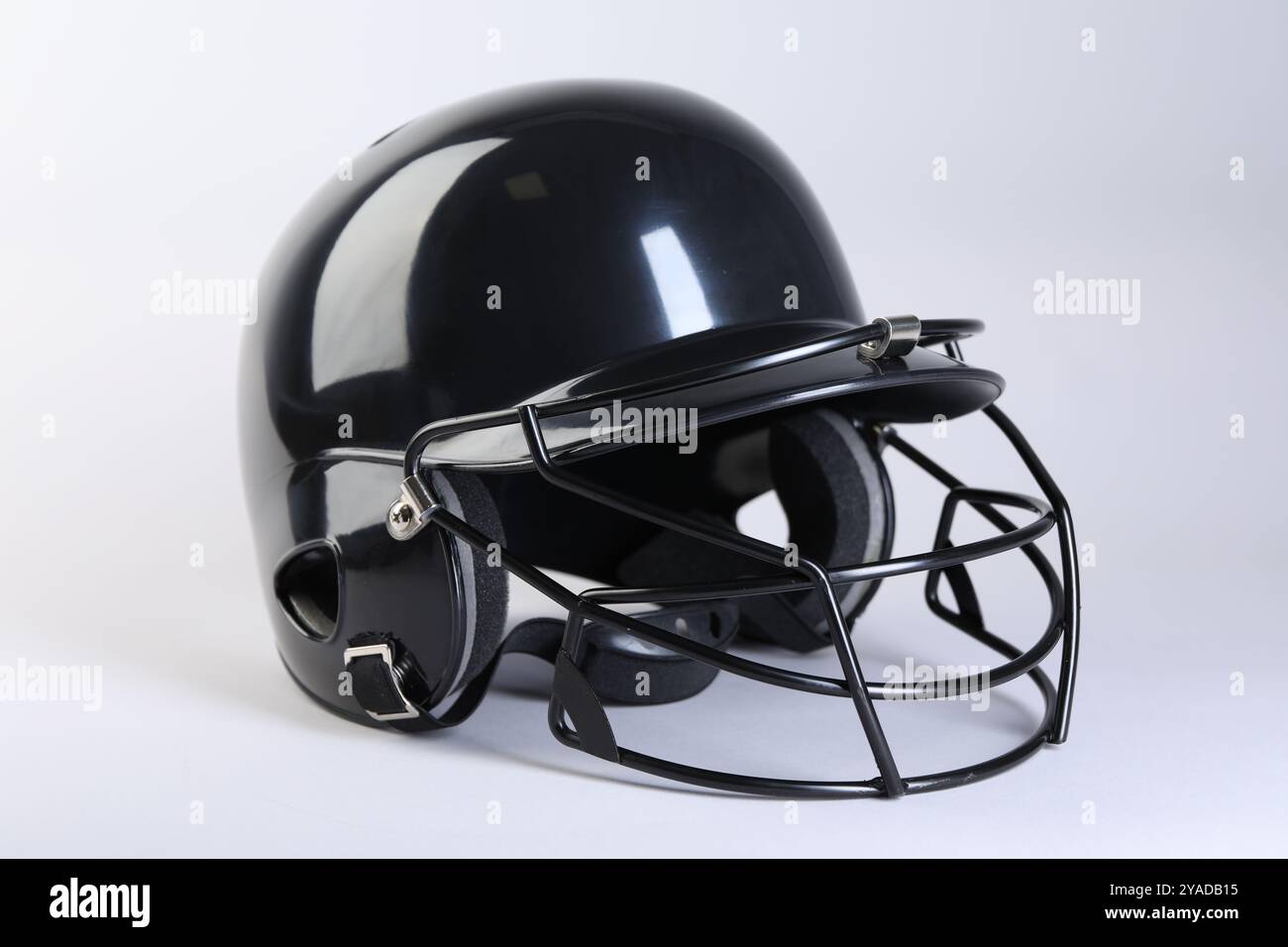 One black baseball helmet on white background Stock Photo - Alamy