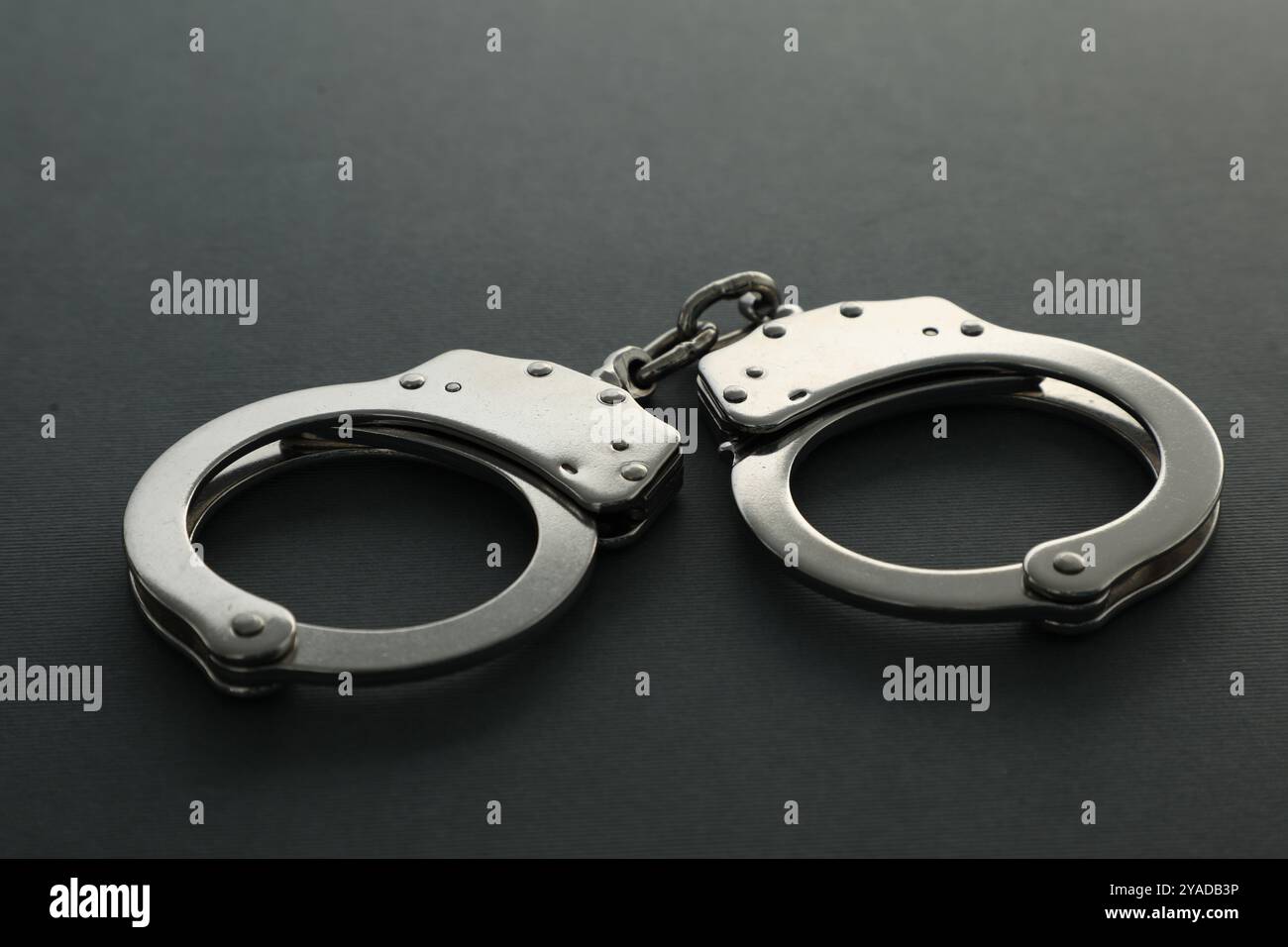 Classic chain handcuffs on black background, closeup Stock Photo - Alamy