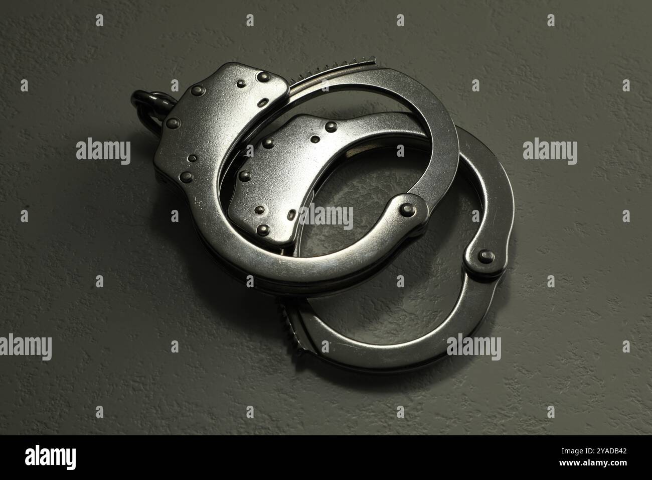 Classic chain handcuffs on grey table, closeup Stock Photo - Alamy
