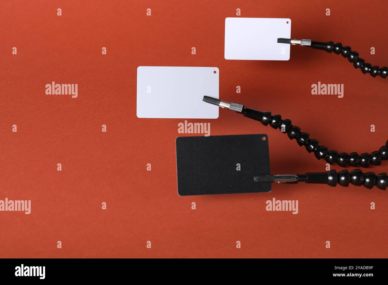 White balance calibration cards on red background Stock Photo - Alamy