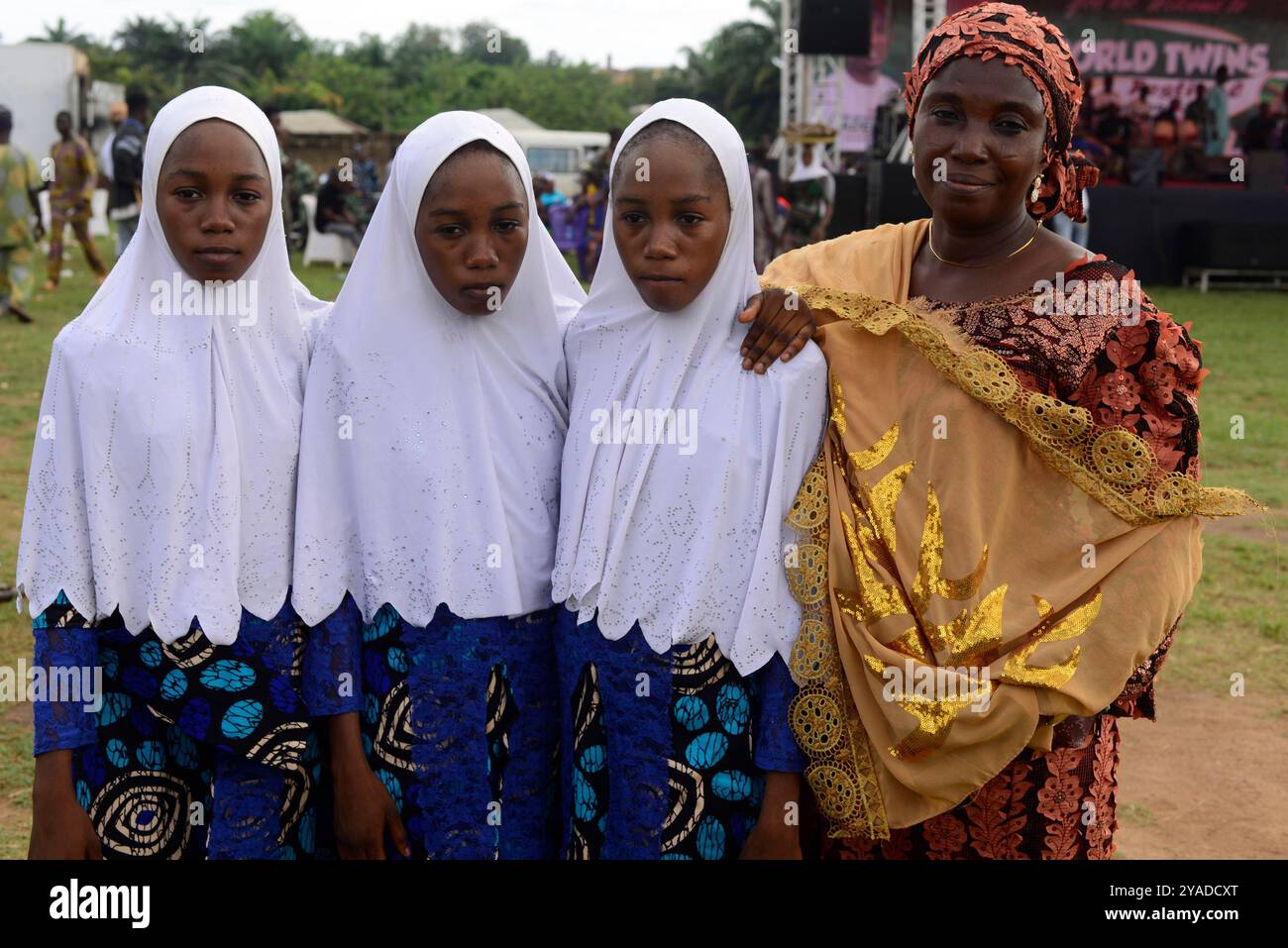 Mrs. Saadat Ismail (R) poses with her triplets, Anida (2nd R), Abiba ...