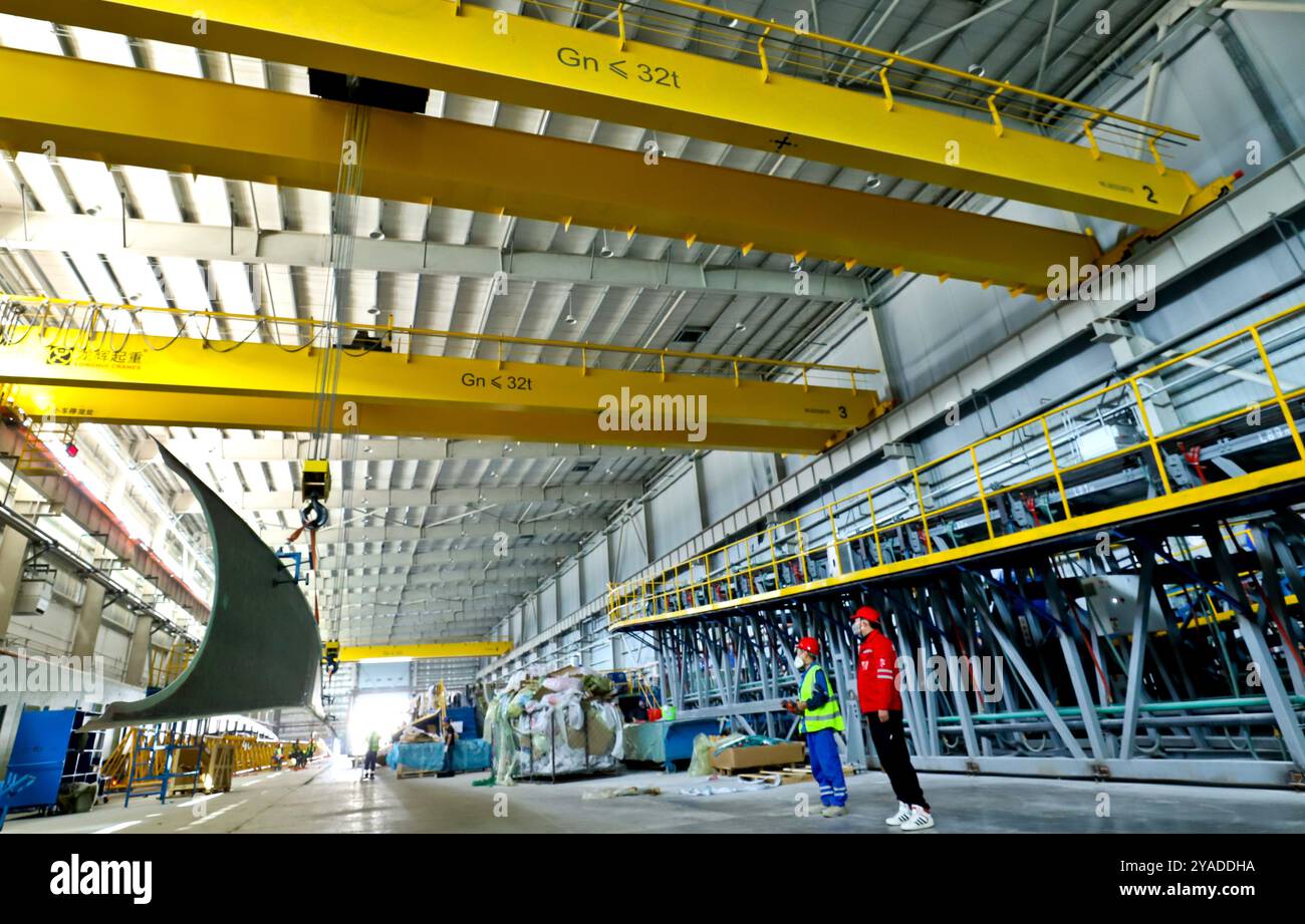 ZHANGYE, CHINA - OCTOBER 12, 2024 - Staff are producing wind turbine ...