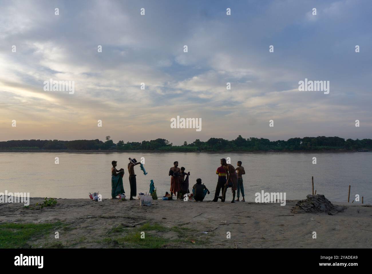 Riverside of Bangladesh. A background image of the sunset. A group of ...