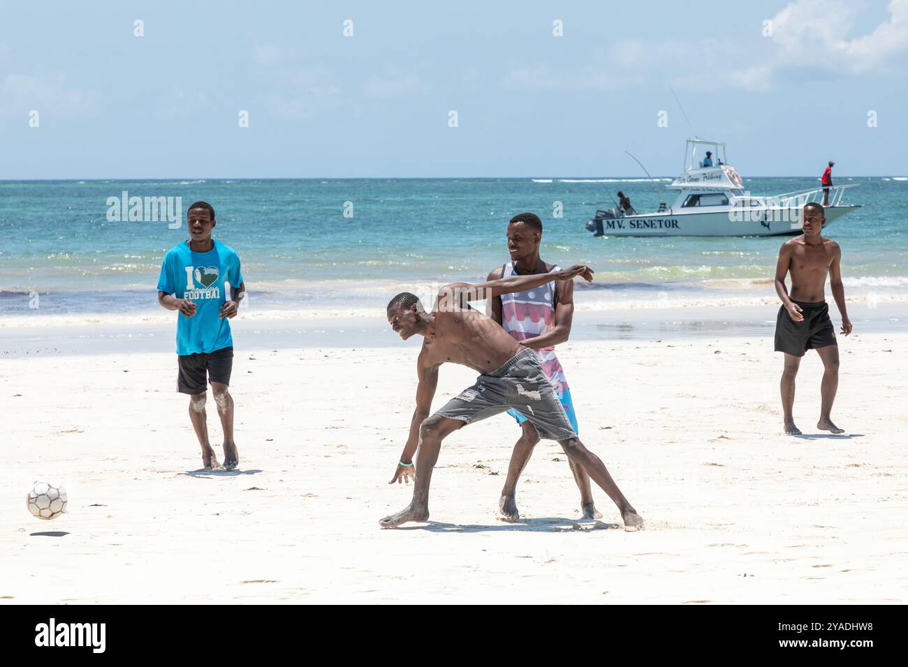 Local boys playing football on Diani Beach, Indian Ocean, Galu district ...